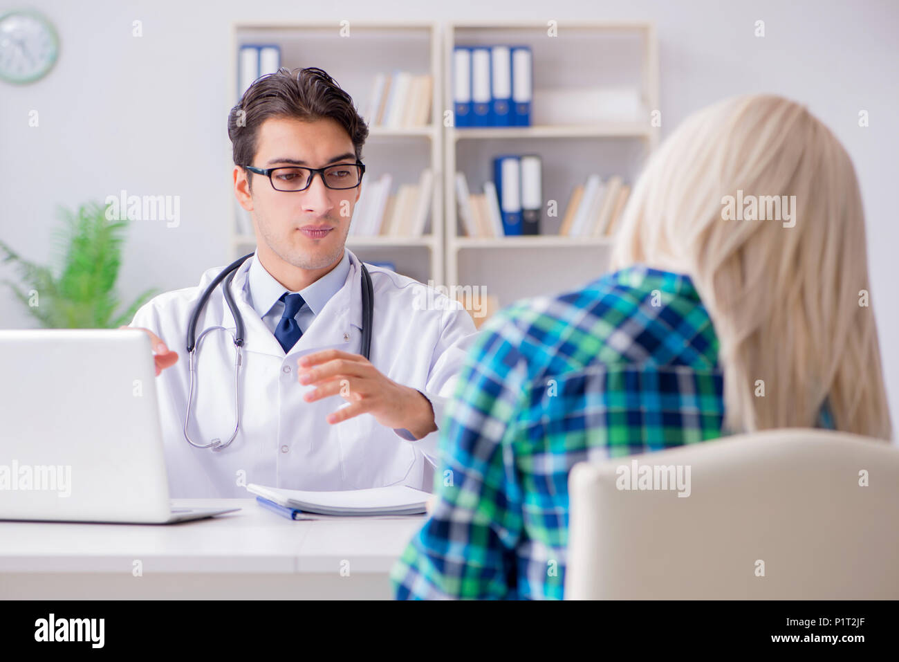 Patient visiting doctor for medical check-up in hospital Stock Photo ...