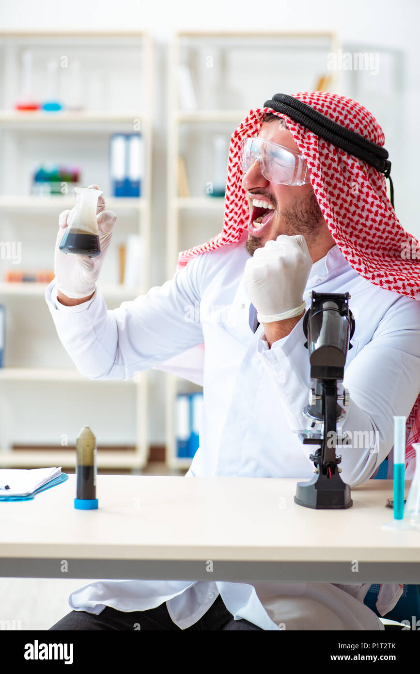 Arab chemist working in the lab office Stock Photo - Alamy