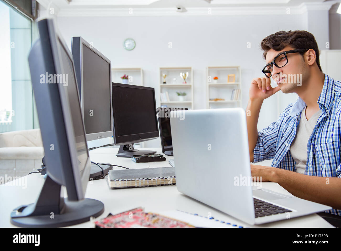 Man in front of many screens hi-res stock photography and images - Alamy