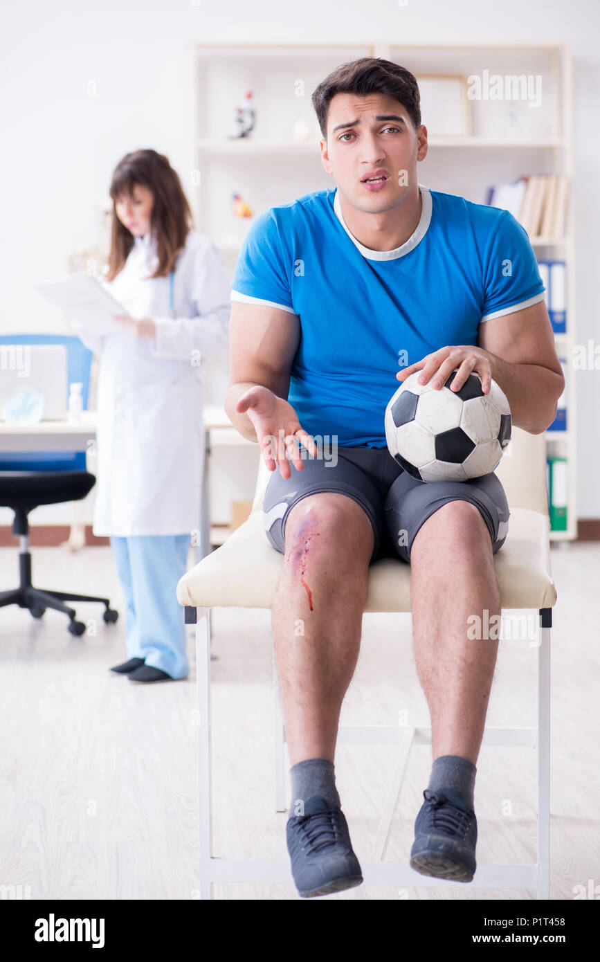 Football soccer player visiting doctor after injury Stock Photo - Alamy