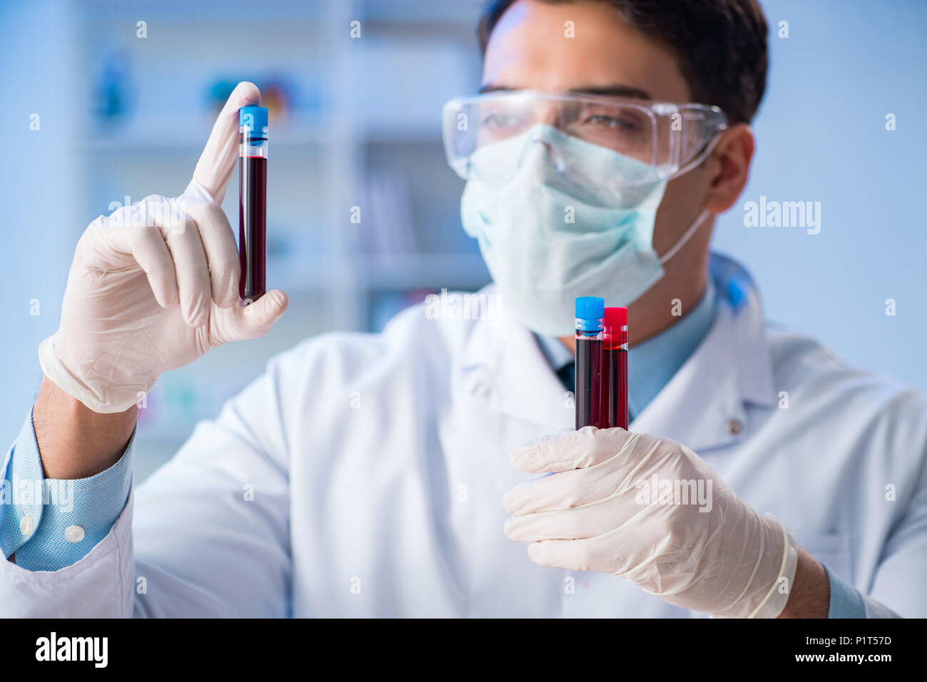 Lab assistant testing blood samples in hospital Stock Photo - Alamy