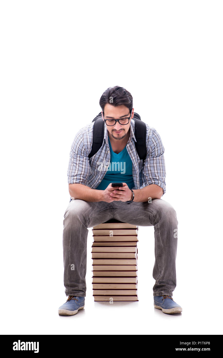 Young student sitting on top of book stack on white Stock Photo - Alamy