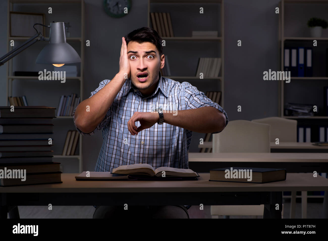 Student preparing for exams late at night Stock Photo - Alamy