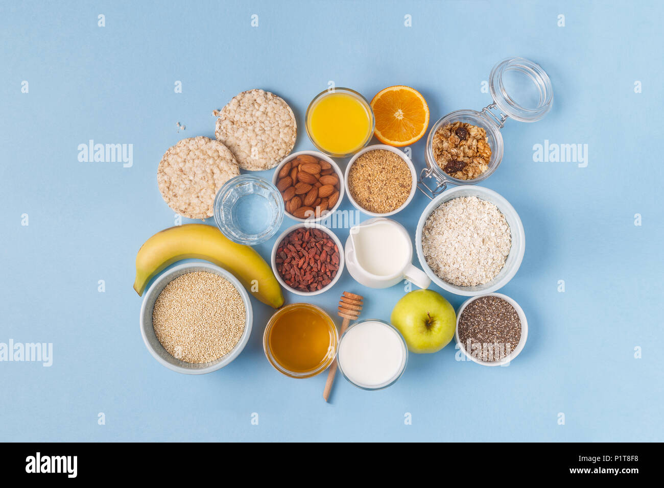 Useful breakfast on a blue pastel background, top view Stock Photo - Alamy