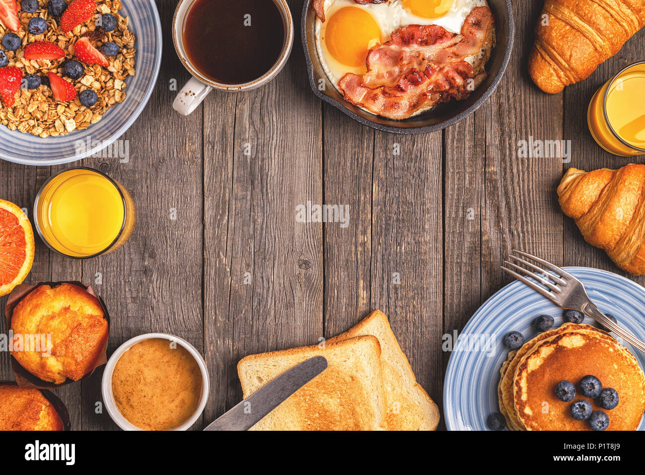 Delicious breakfast on a rustic table. Top view, copy space Stock Photo ...