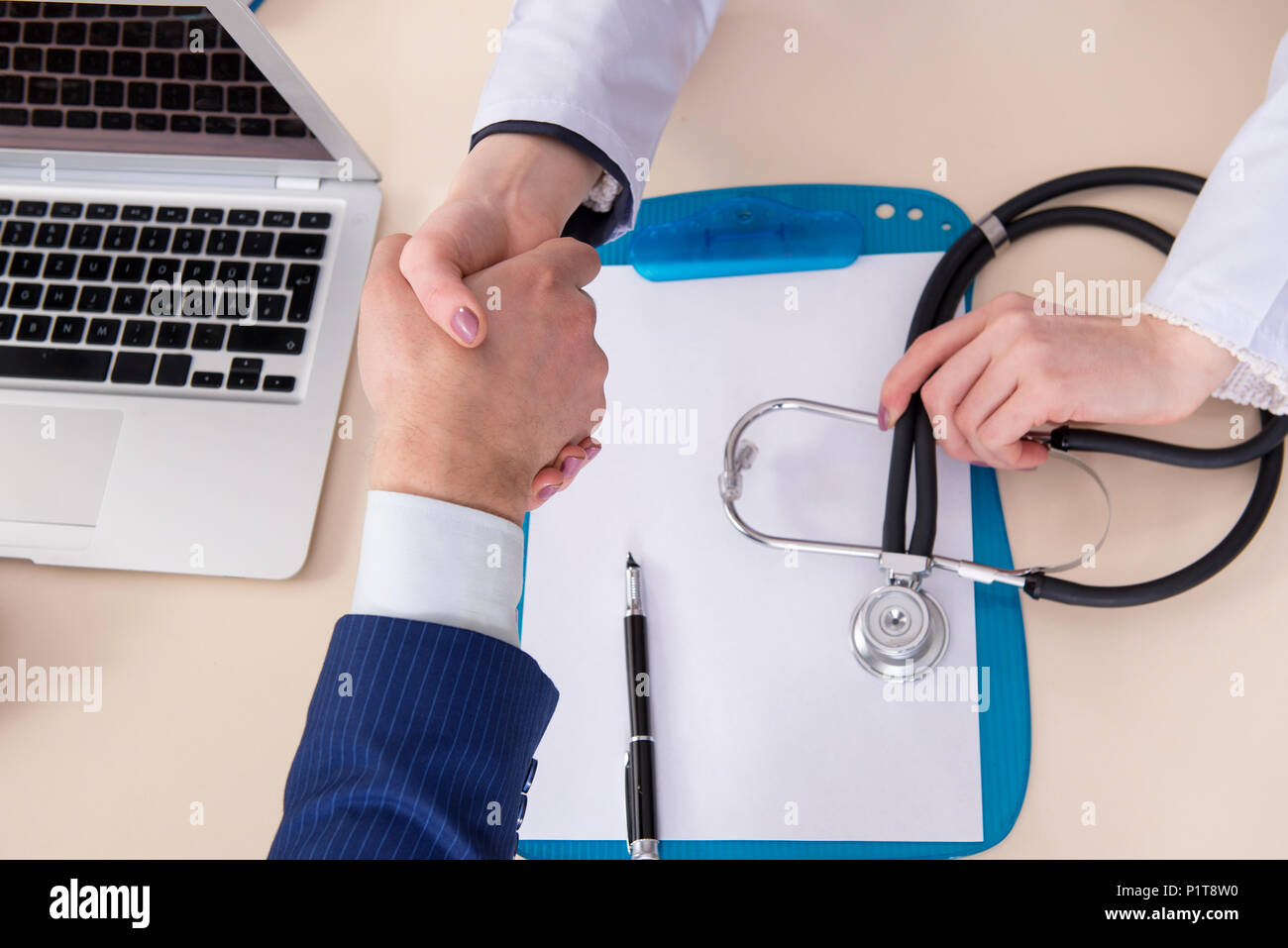 Man signing medical insurance contract Stock Photo - Alamy