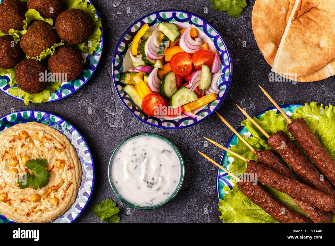 Classic kebabs, falafel and hummus on the plates. Top view Stock Photo ...