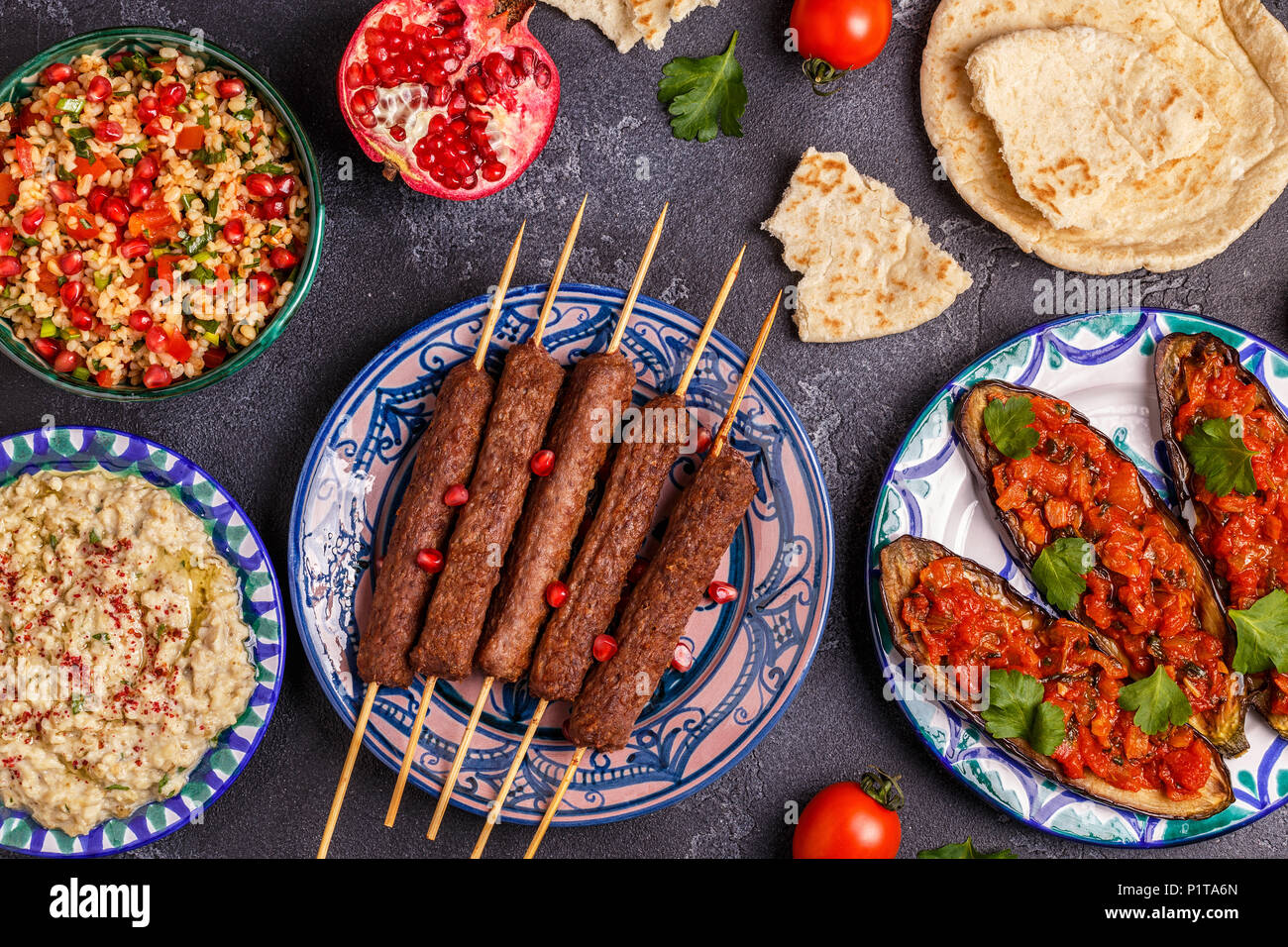 Classic kebabs, tabbouleh salad, baba ganush and baked eggplant with ...