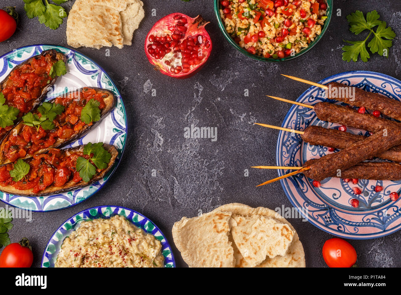 Classic kebabs, tabbouleh salad, baba ganush and baked eggplant with ...