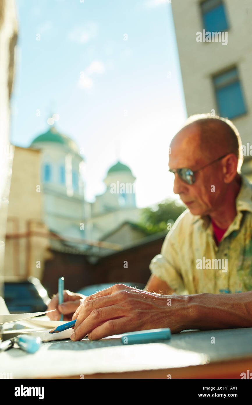 Close up man working of Architect sketching a construction project on ...