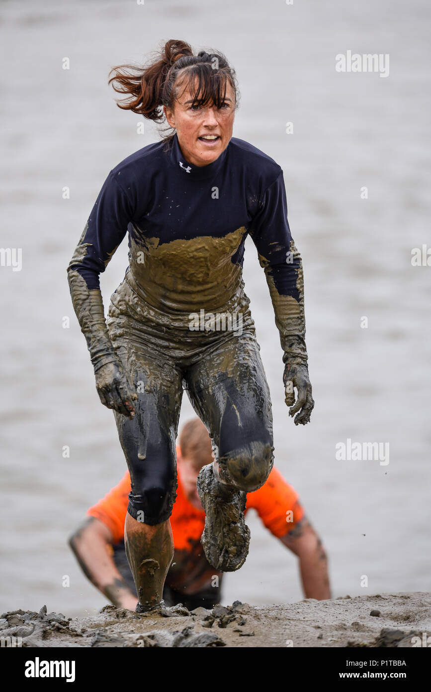 Woman running mud hi-res stock photography and images - Alamy