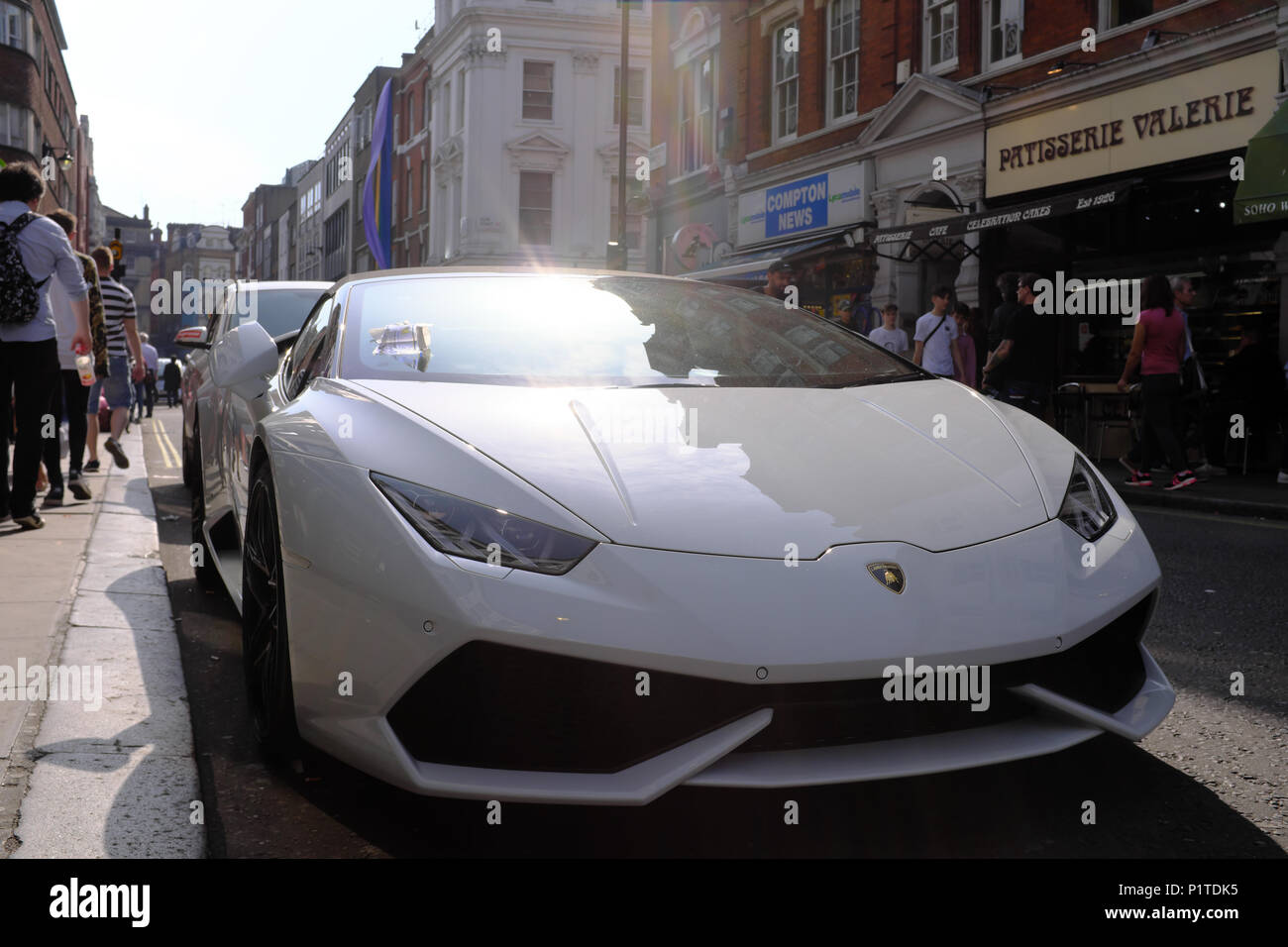 Lamborghini sports car with parking fines on windscreen, Soho, London ...