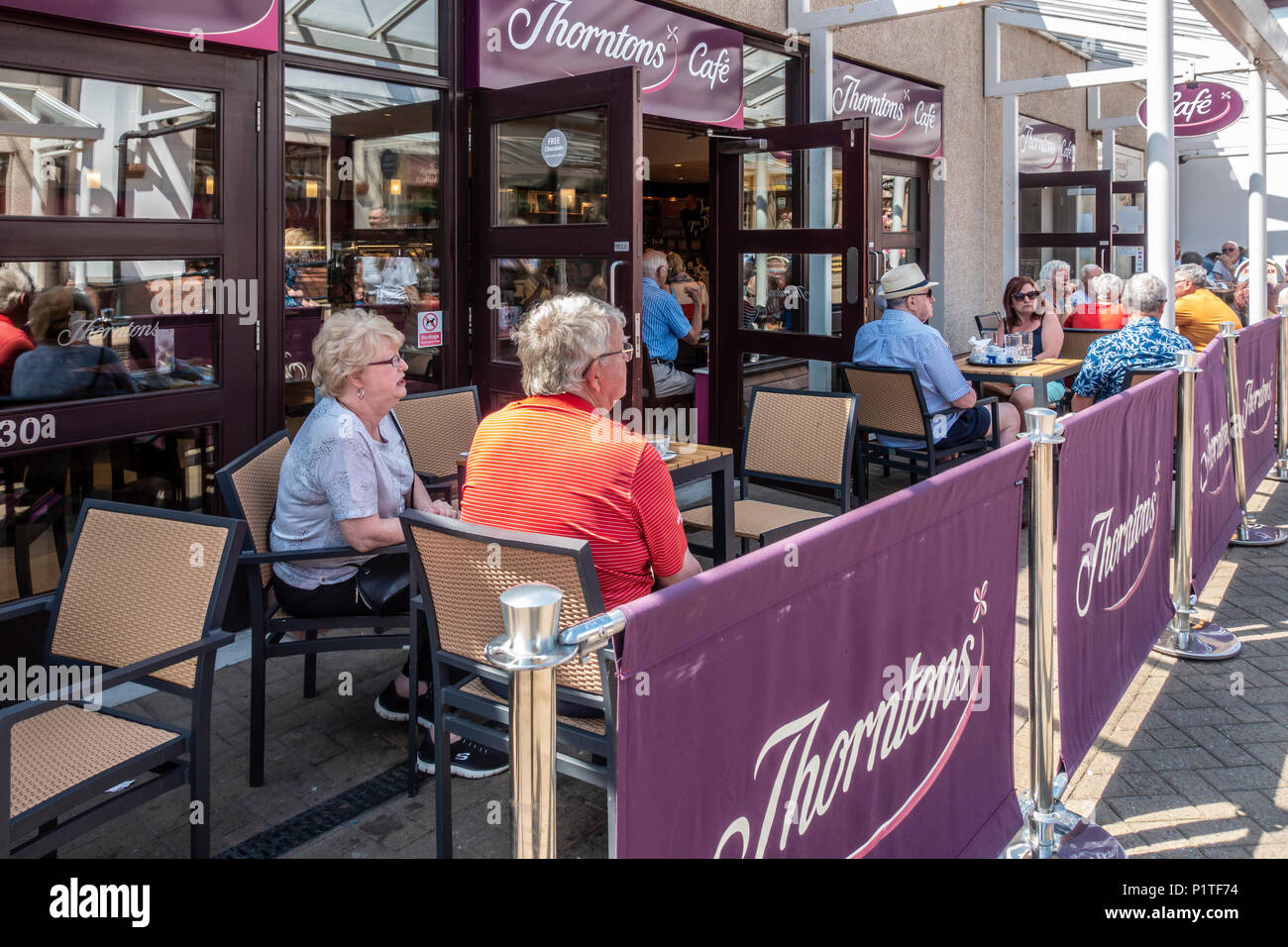 Customers in the outdoor seating area of the Thorntons Cafe in Gretna ...