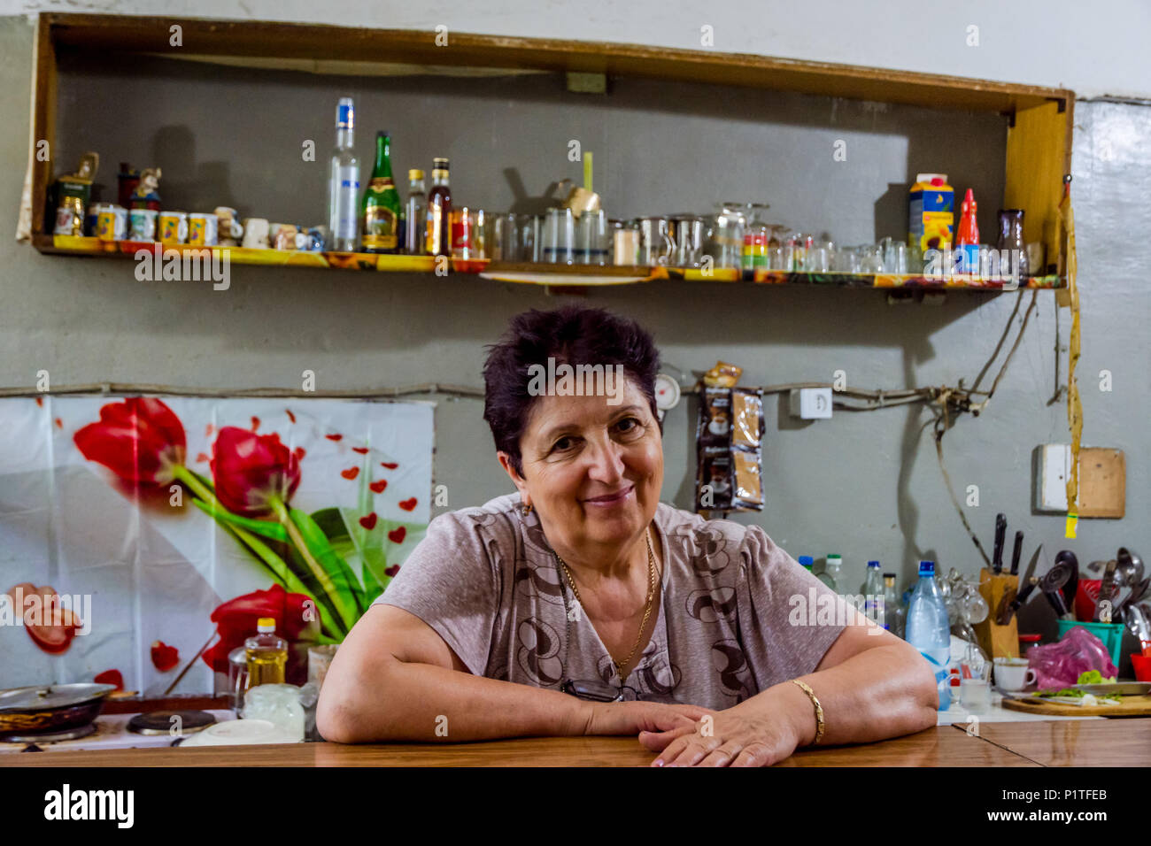 Senior woman, restaurant owner posing at the bar in Stepanakert ...