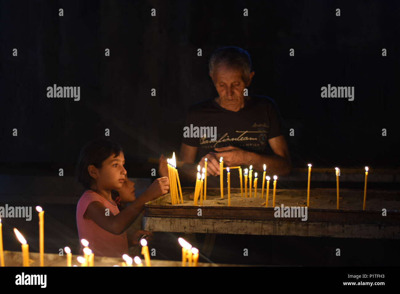 People lighting up candles hi-res stock photography and images - Alamy