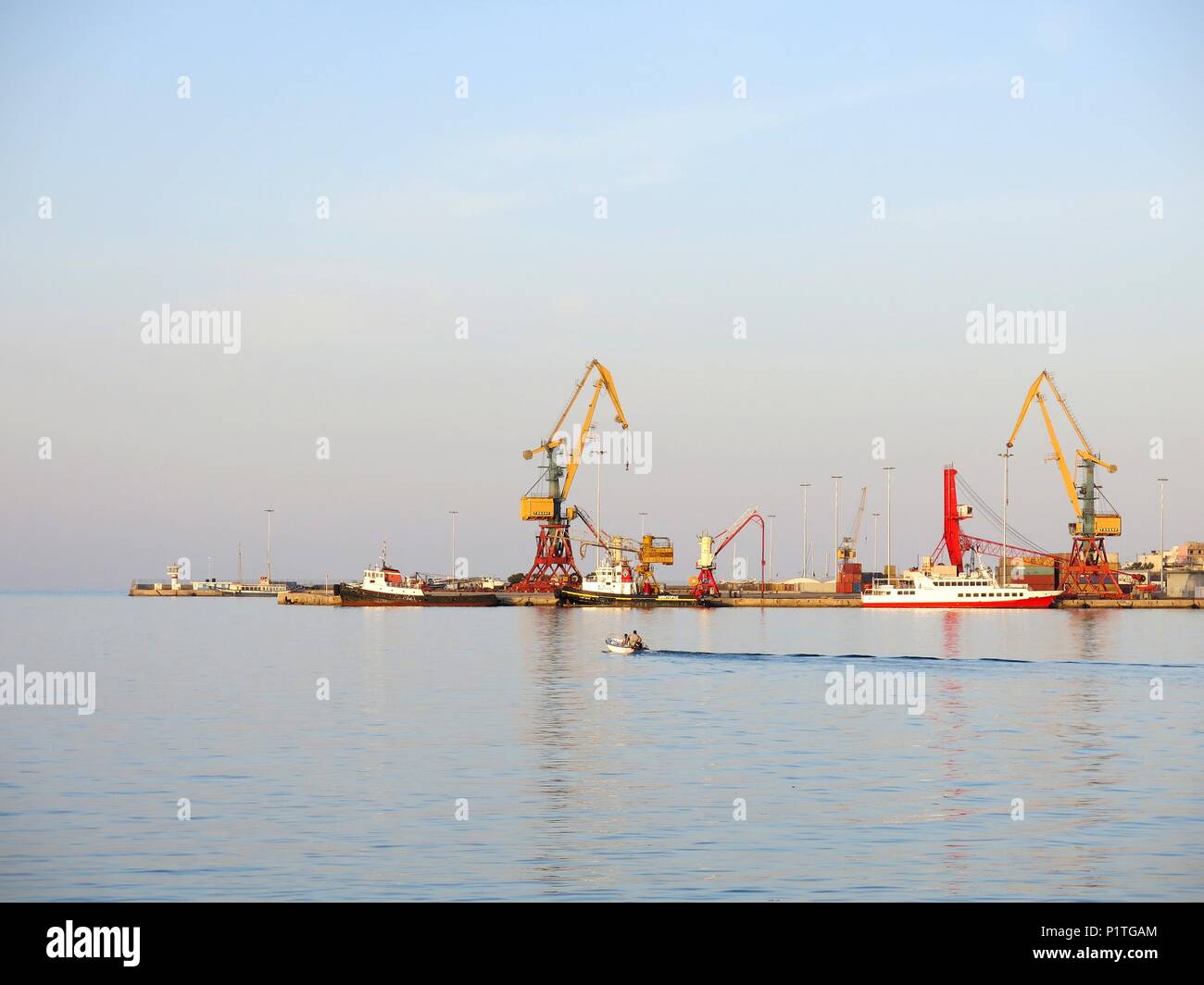Harbour setting with boats moored calm sea hi-res stock photography and ...