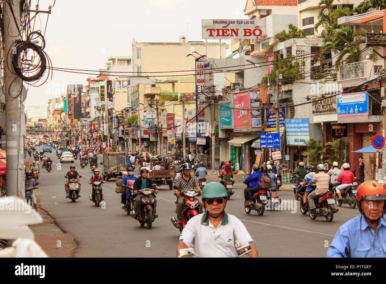 Saigon, Vietnam - January 2014: Scooter traffic on crowded streets with ...