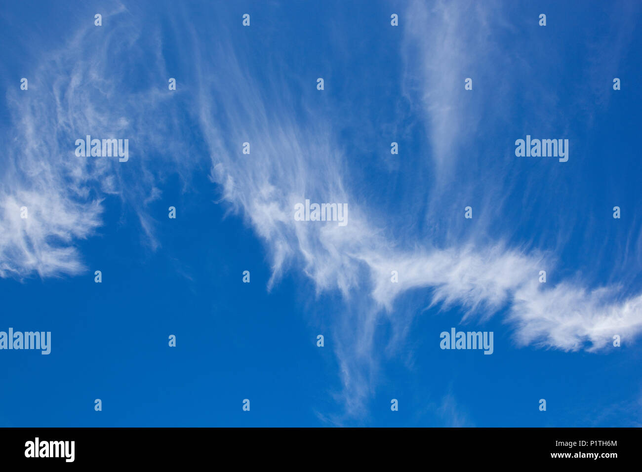 Summer sky cloud pattern background with wispy white feathery clouds on ...