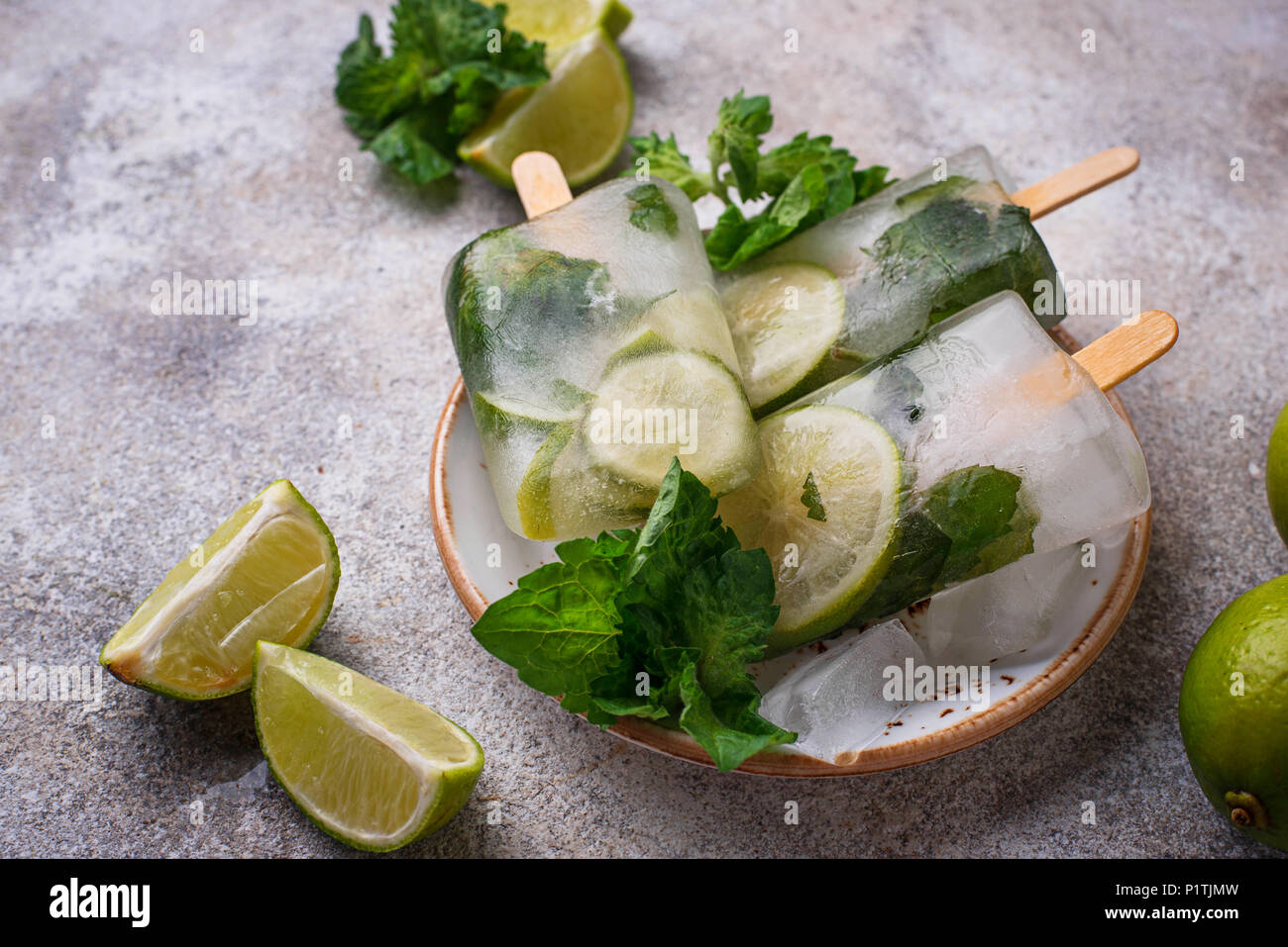 Mojito cocktail popsicle with mint, lime and rum Stock Photo - Alamy