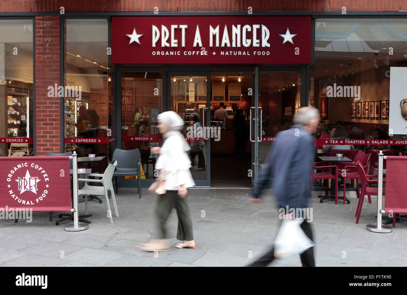 a pret a manger restaurant exterior view. Shops and people shopping in ...
