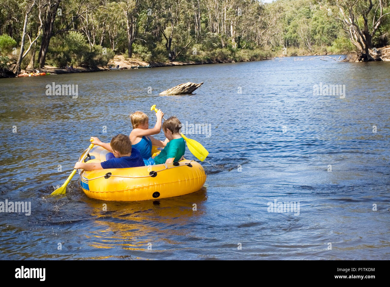 Children Paddling In A Boat High Resolution Stock Photography and ...