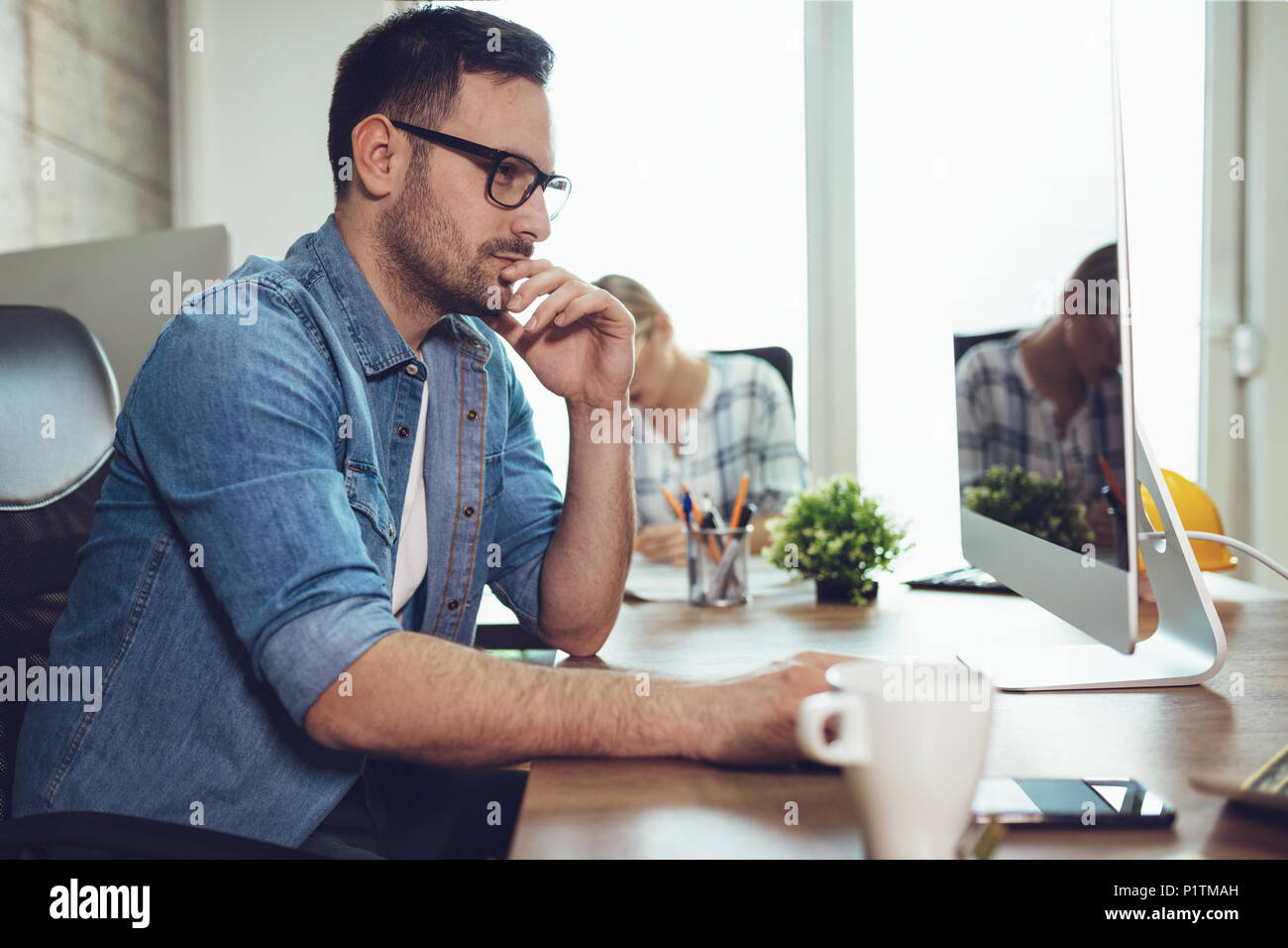 Serious computer engineer working hi-res stock photography and images ...