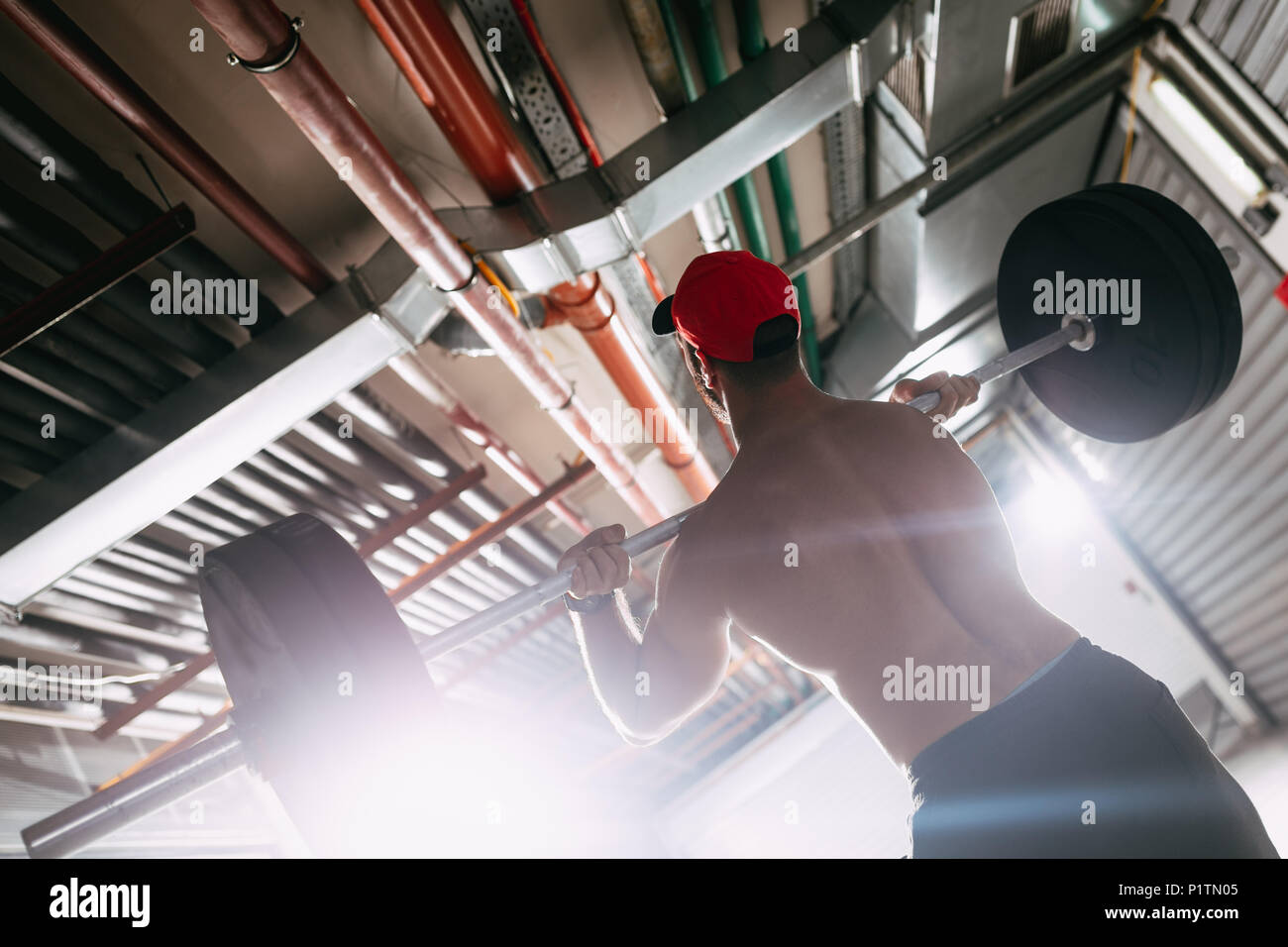 Strength training exercise man gym hi-res stock photography and images ...