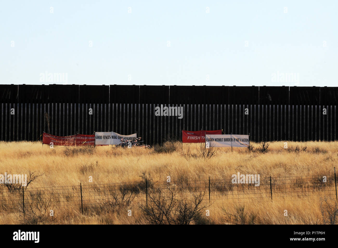 Signs placed by the American Border Patrol commenting about the wall ...