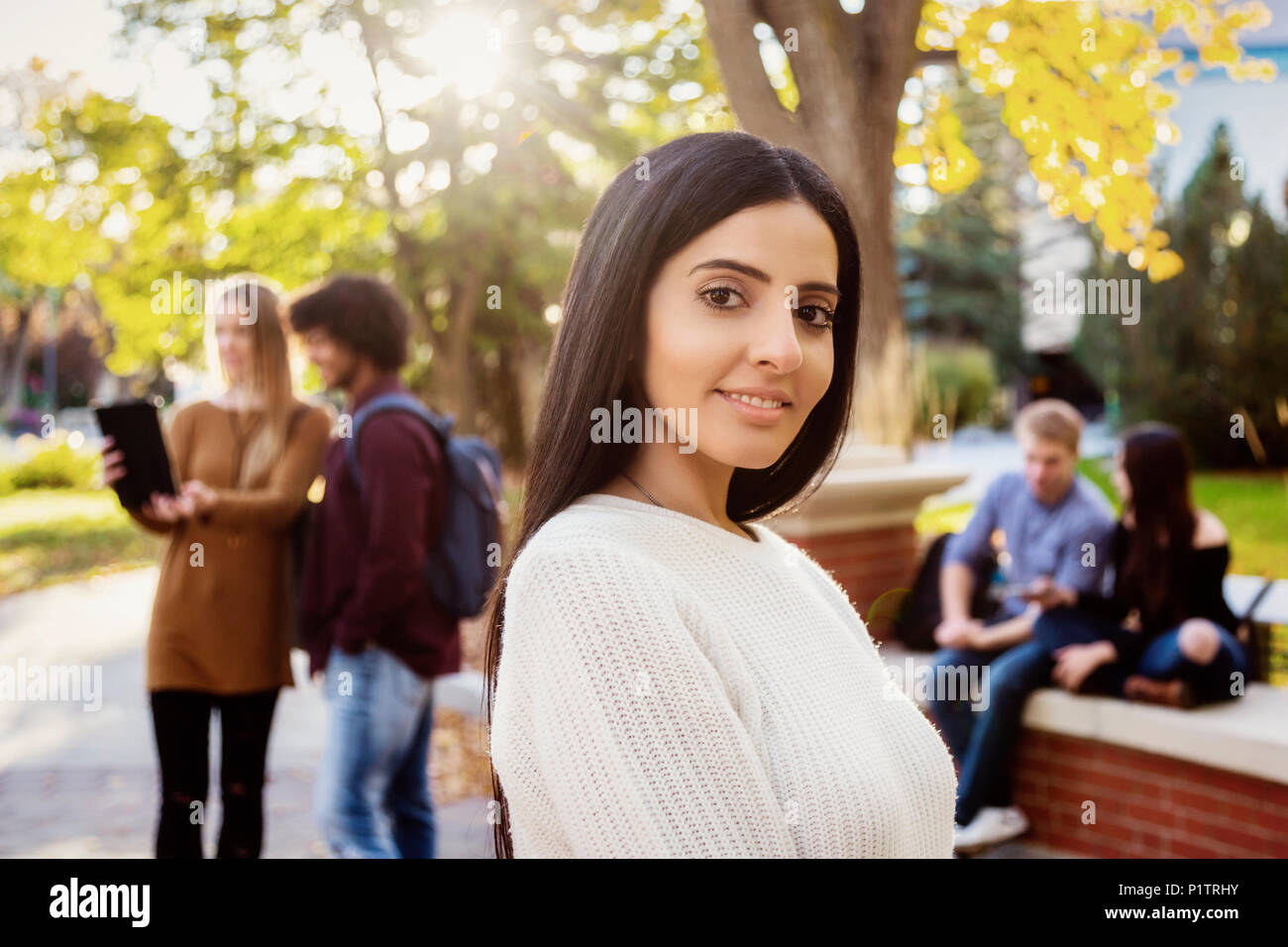 A young female university student of Lebanese ethnicity poses while her ...