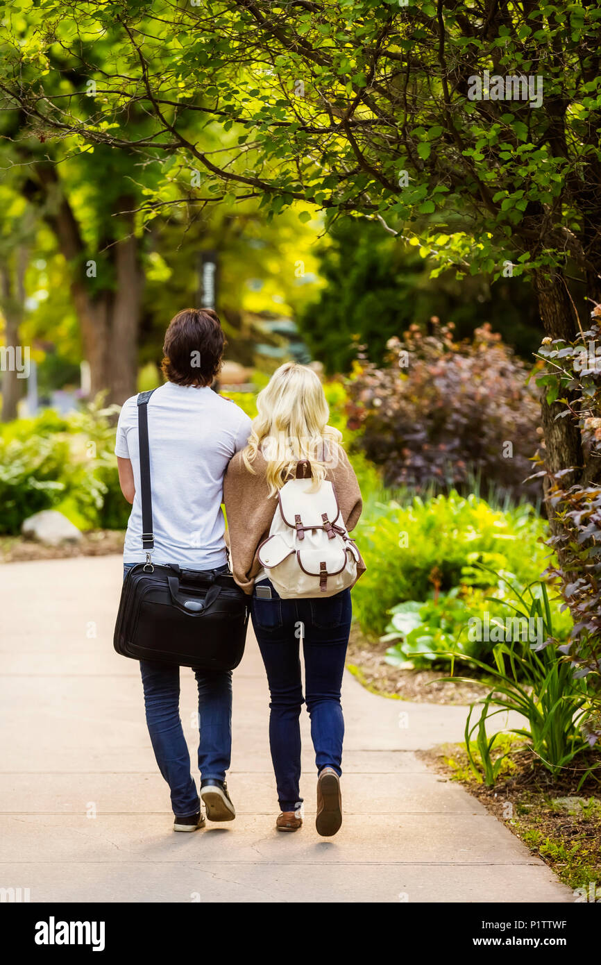 Young couple walking away from camera hi-res stock photography and ...