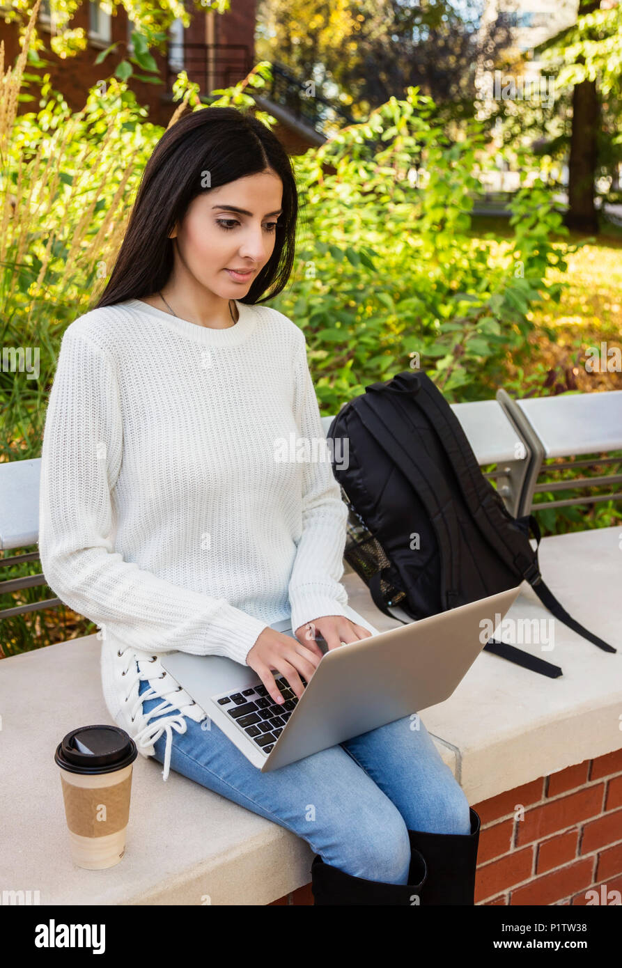 A young female university student of Lebanese ethnicity sitting on a ...