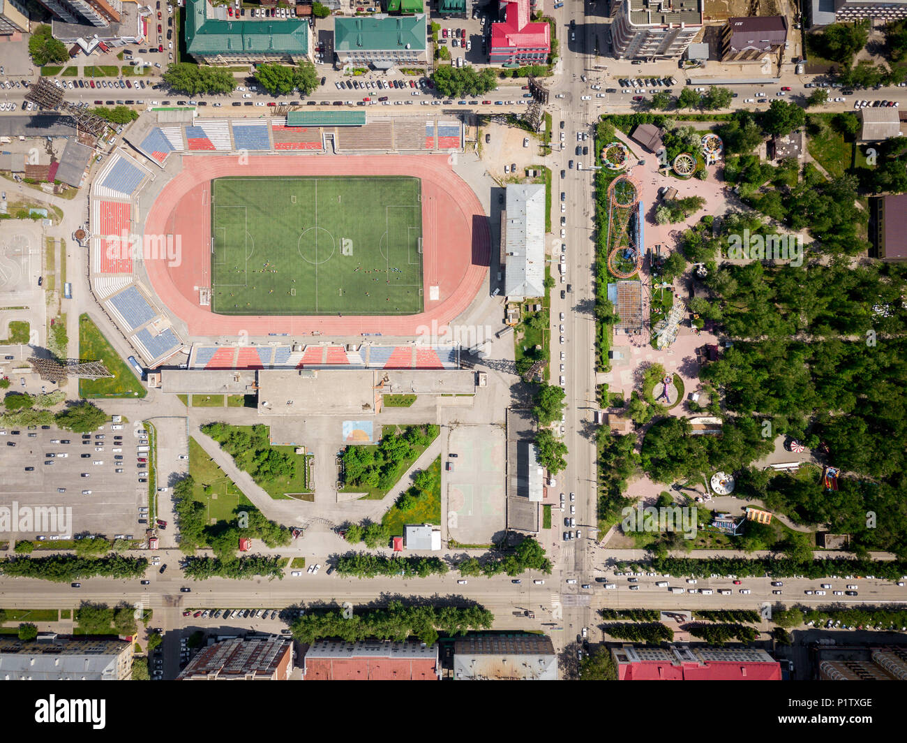 Aerial photography of a modern stadium with green field for football, a ...