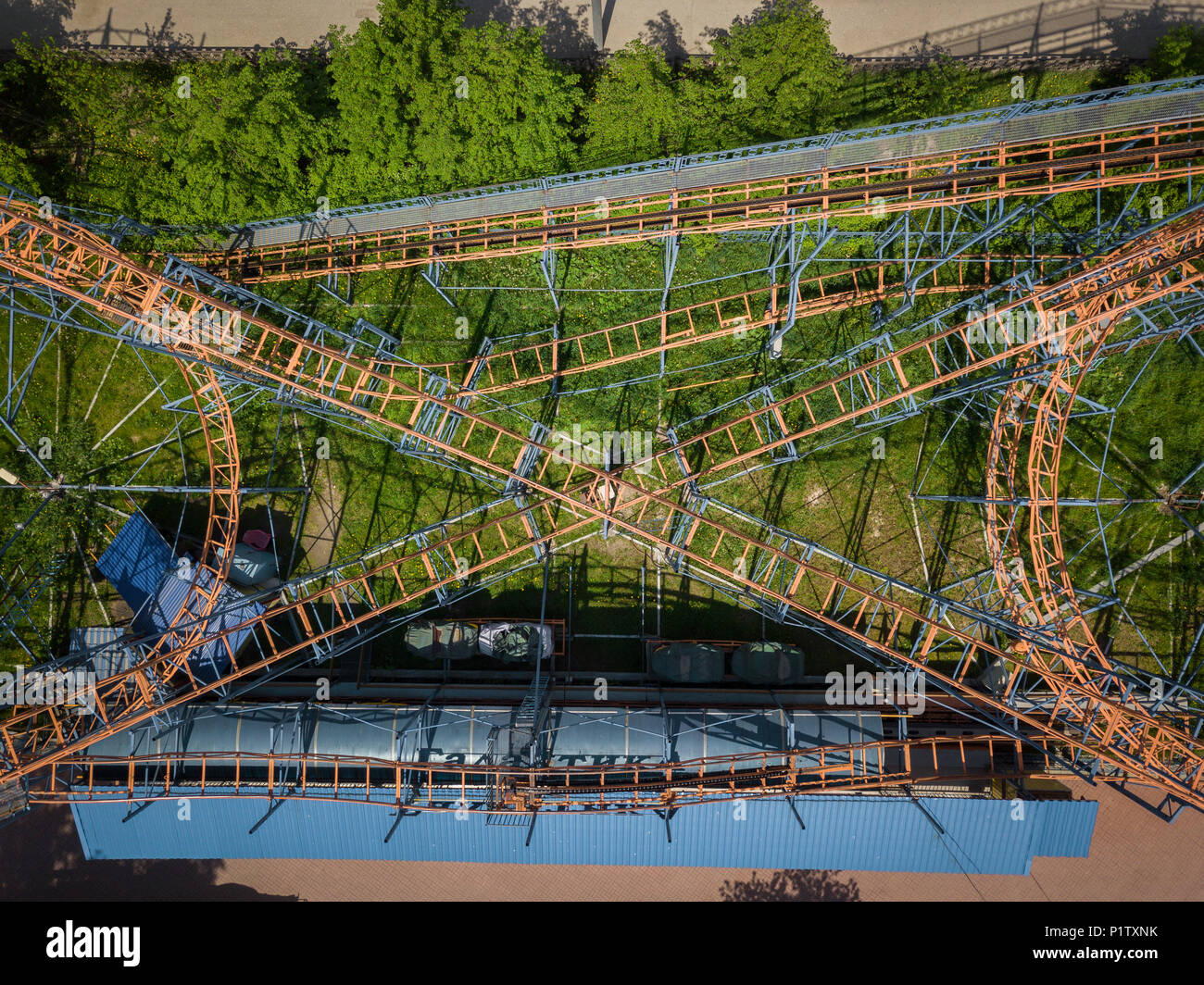 Aerial photography of a children's orange roller coaster with loops and ...