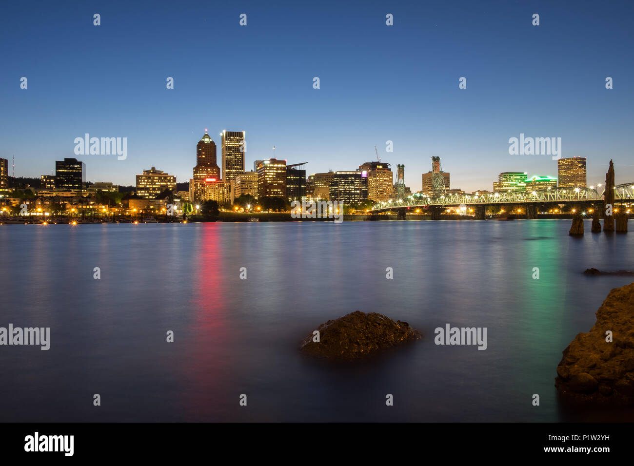City Skyline and waterfront at night with river in foreground Stock ...