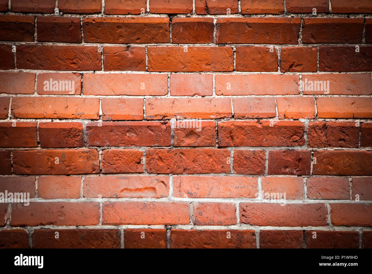 Red brick wall with stripes of different colors, texture grunge ...