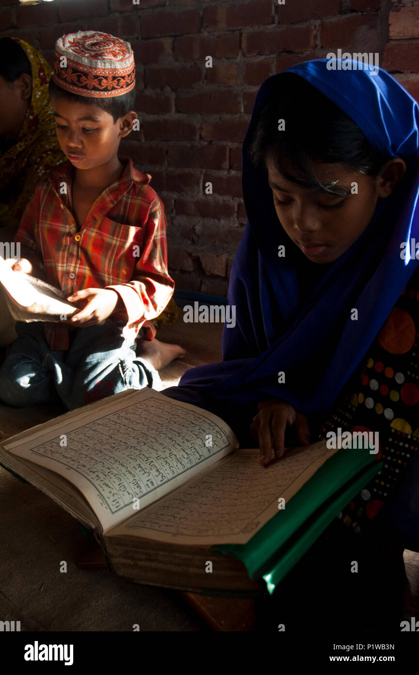 Students reading the Holy Quran at a maktab. Maktab an Arabic word ...