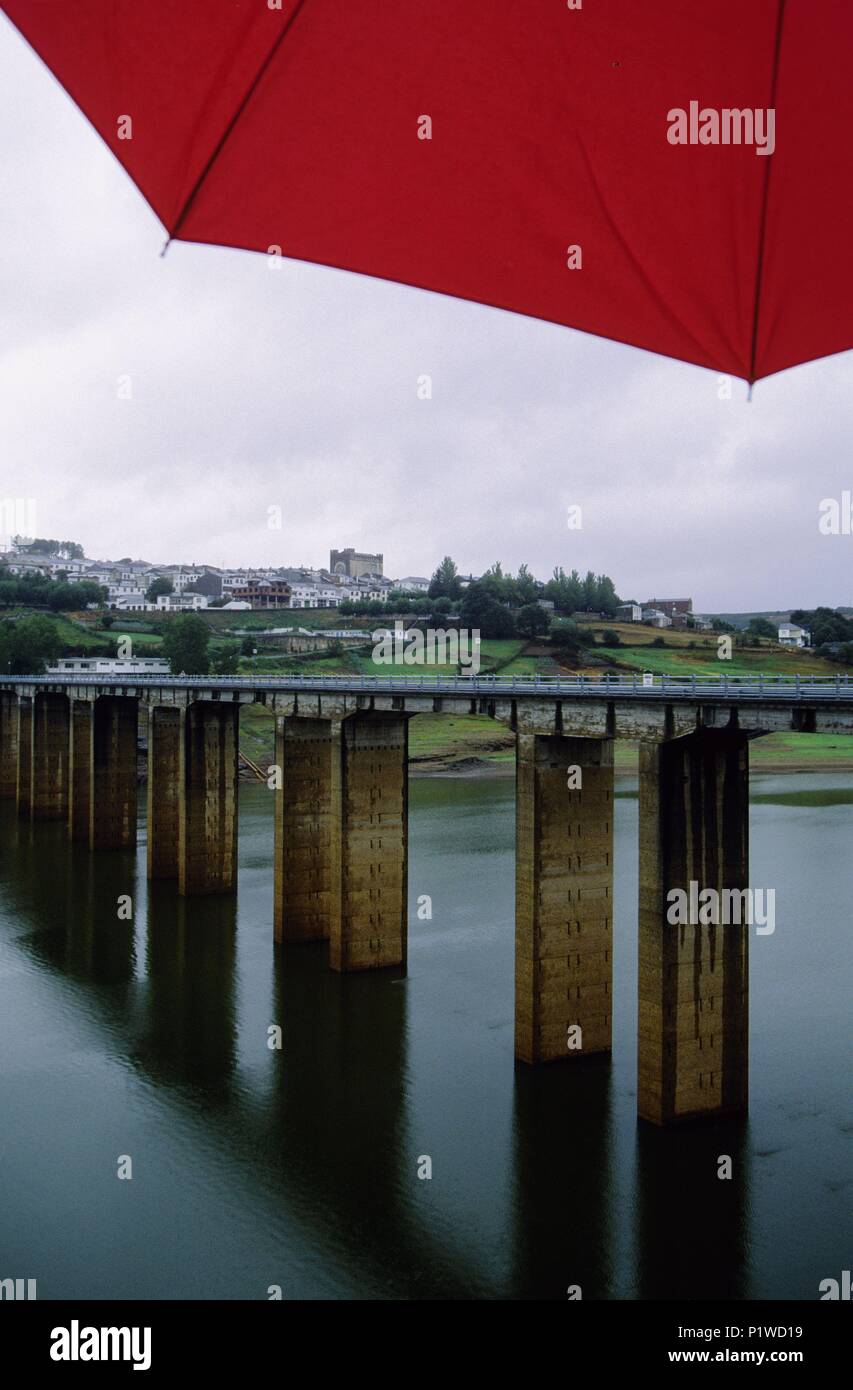 Portomarín; town view with the bridge over the dam at a rainy day; Sant ...