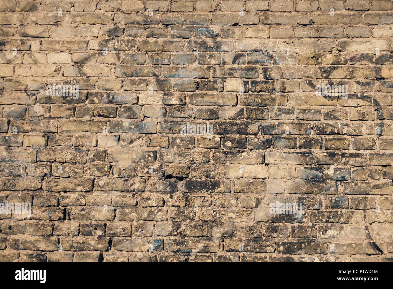 Old brick wall with graffiti fragments Stock Photo - Alamy