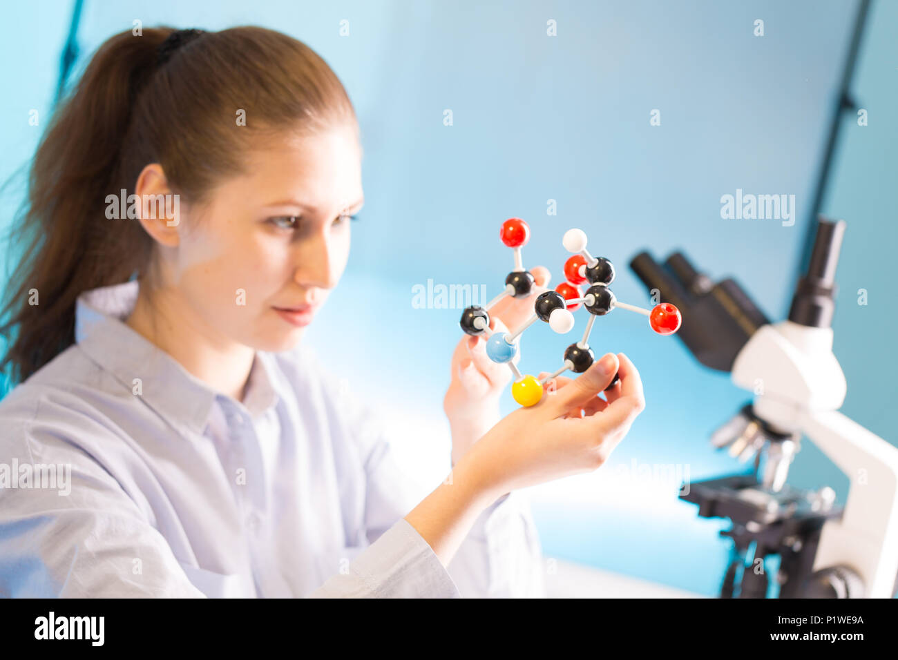 scientist woman holding molecule model Stock Photo - Alamy