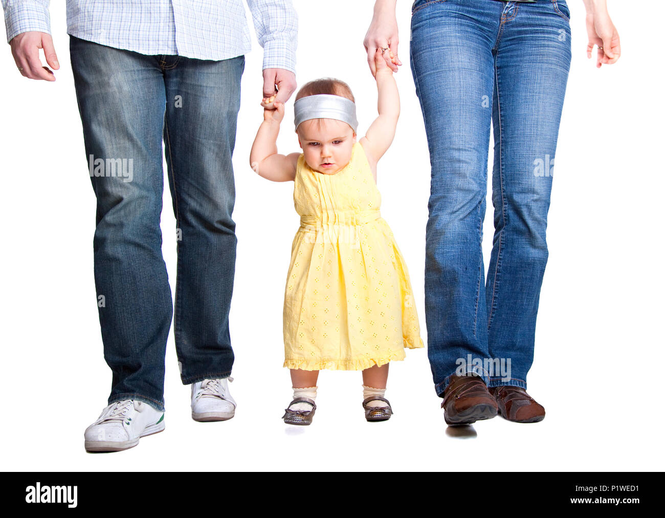 Happy family. Father, mother and baby's first steps Stock Photo - Alamy