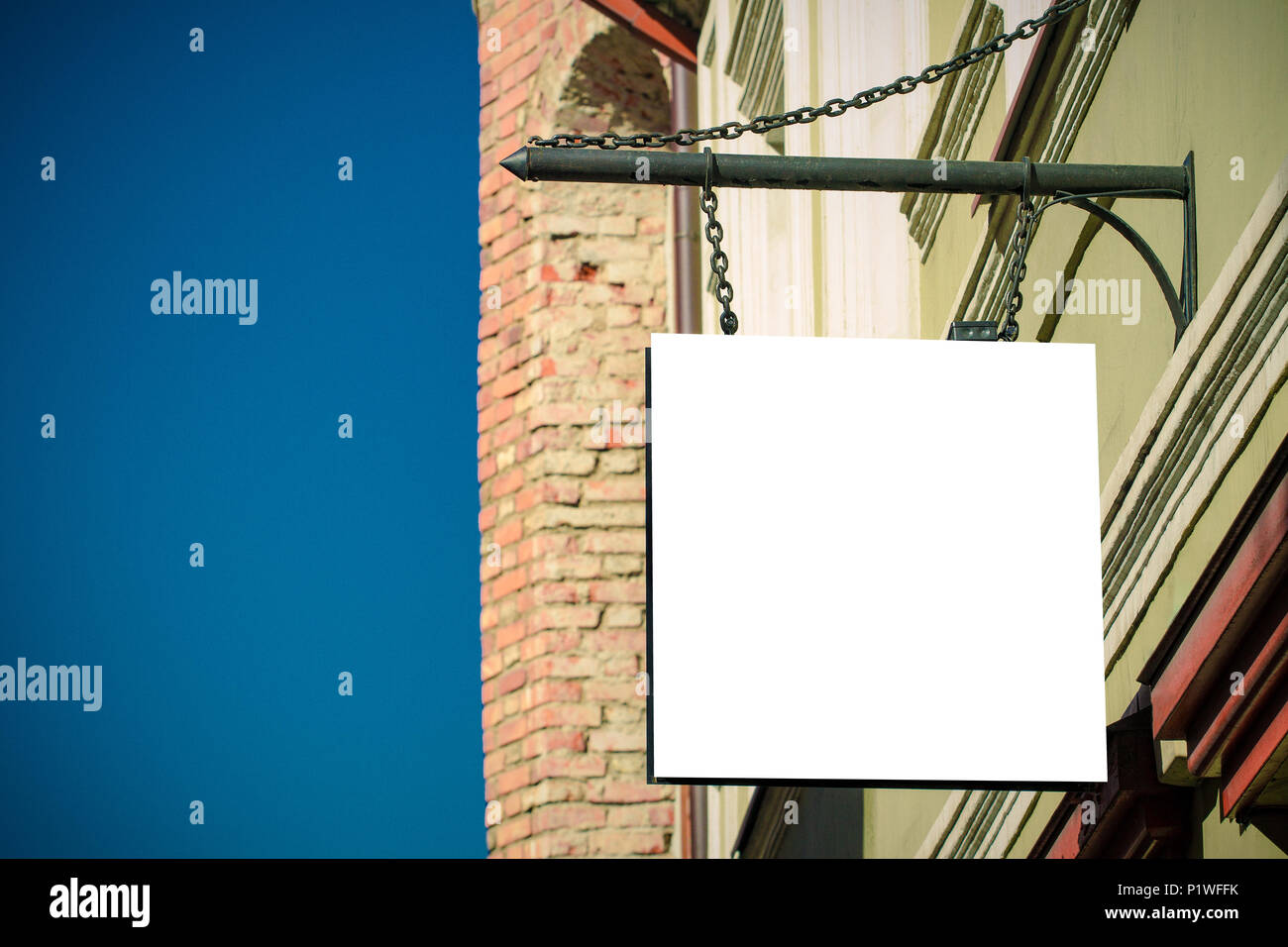 Mock up. Blank white signage on the wall of classical architecture ...