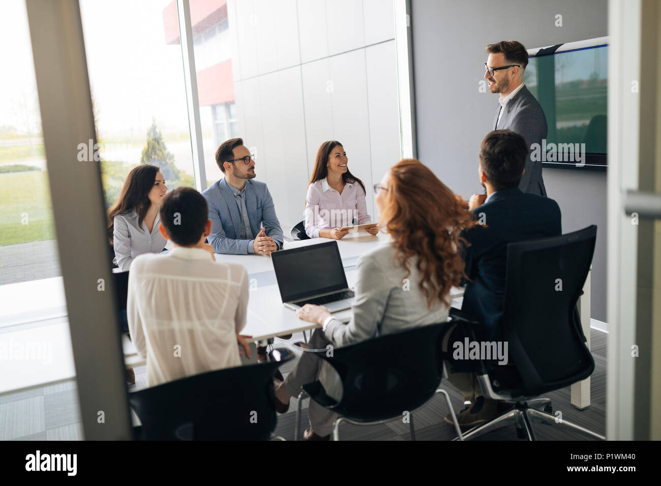 Group of business people collaborating in office Stock Photo - Alamy