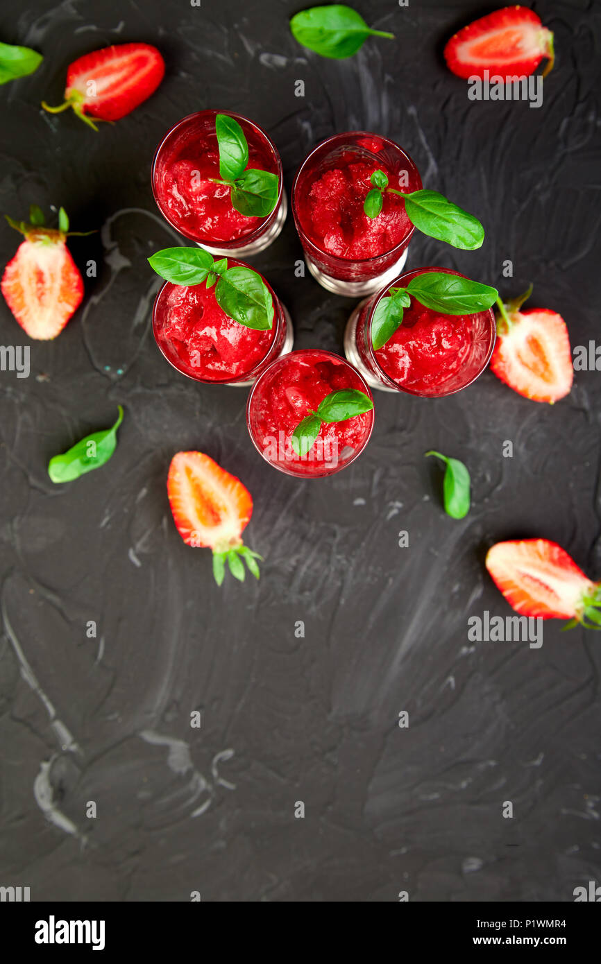 Summer refreshing strawberry sorbet, slush granita drink in serving ...