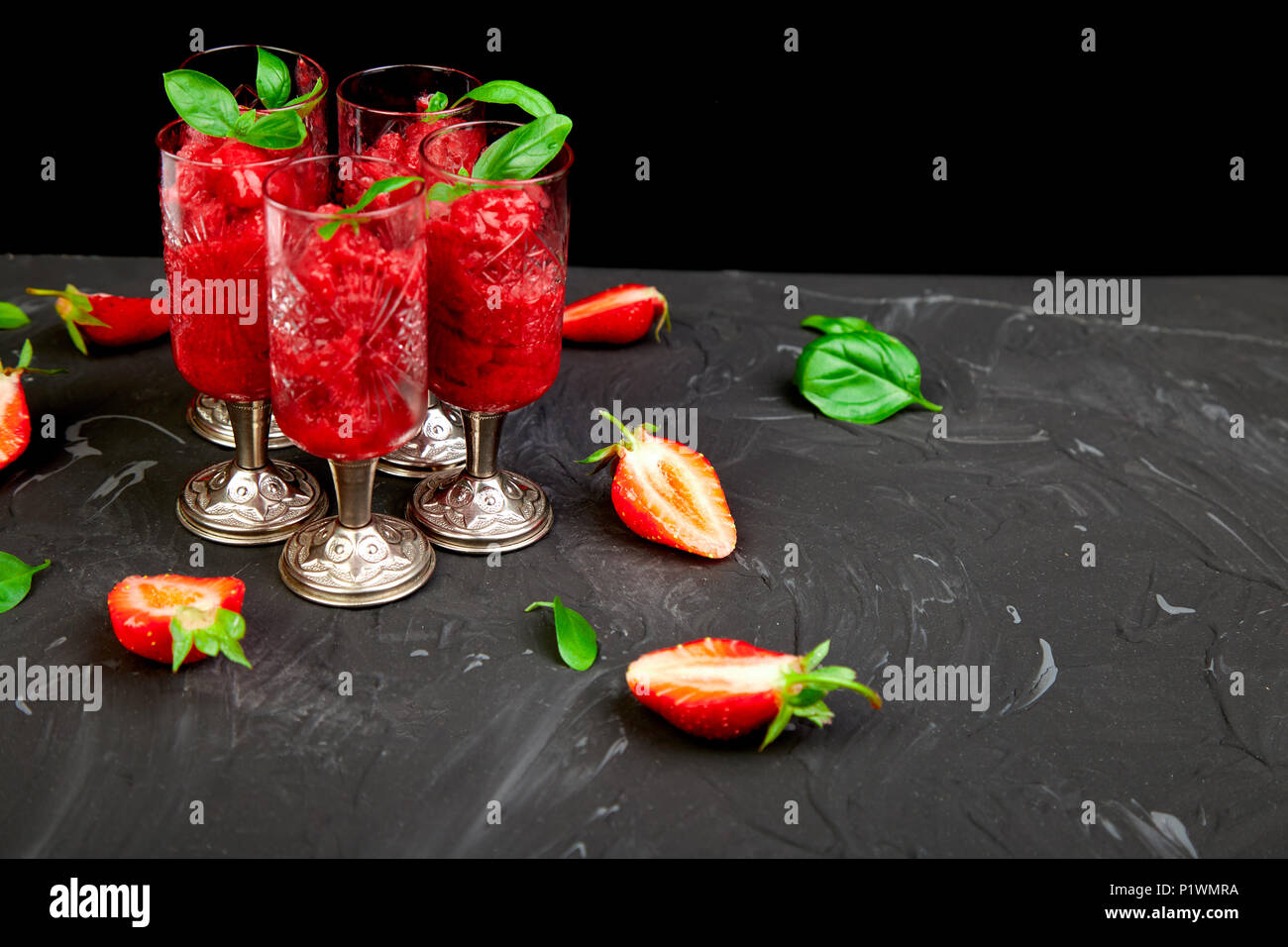 Summer refreshing strawberry sorbet, slush granita drink in serving ...