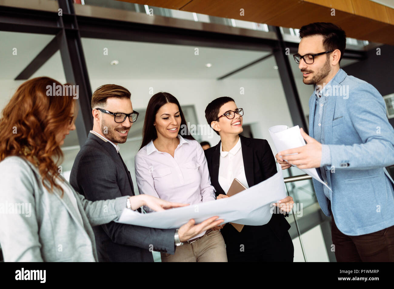 Group of architects working on project Stock Photo - Alamy