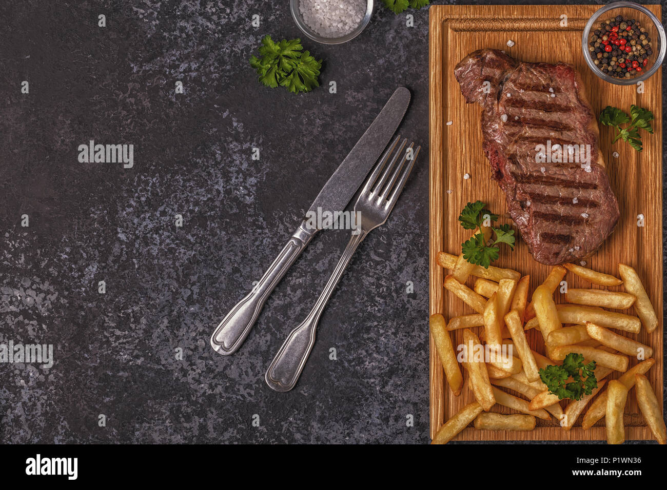 Beef barbecue steak with french fries, top view Stock Photo - Alamy