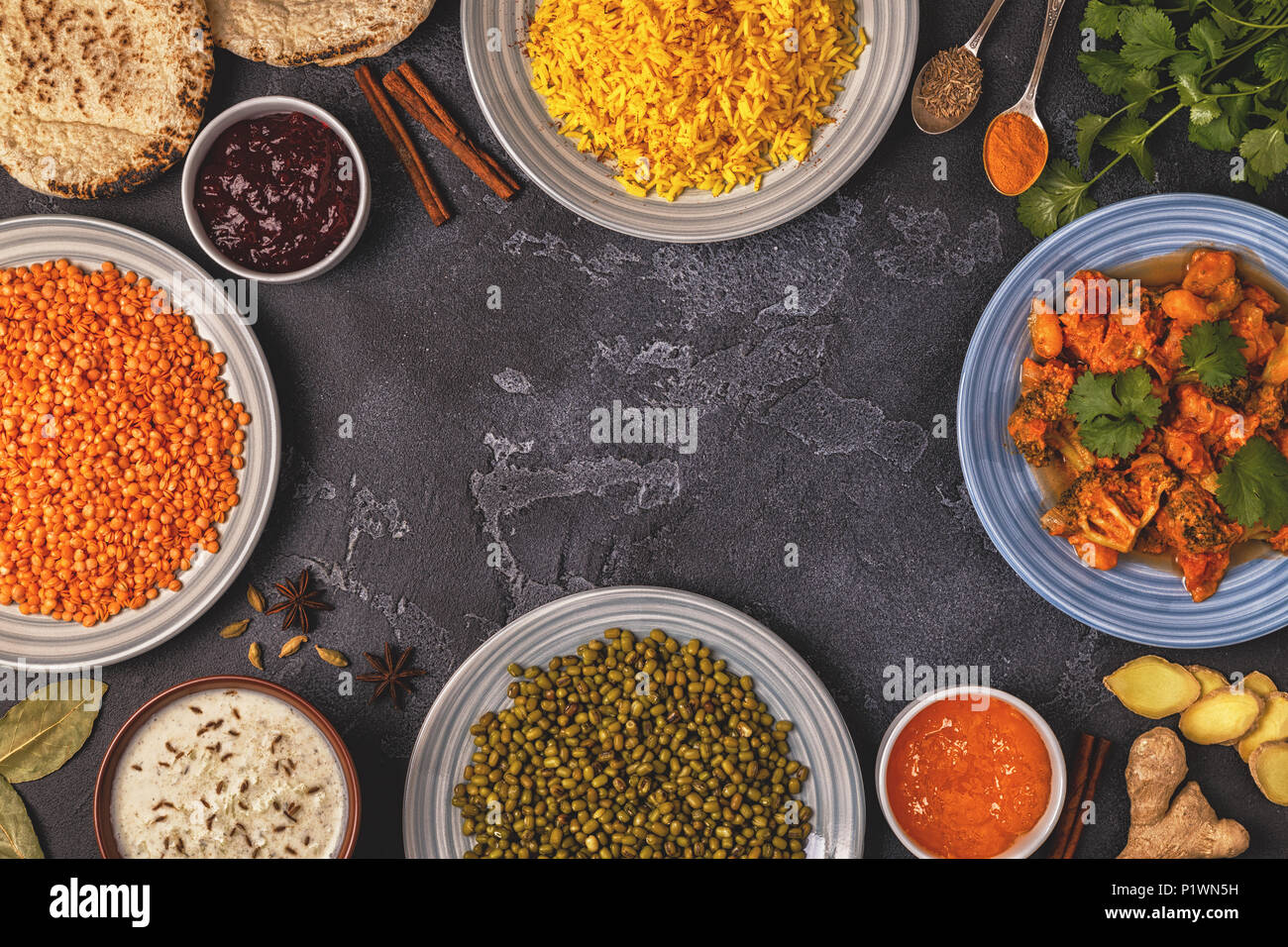 Traditional Indian curry with rice, lentils and mung beans. Top view ...