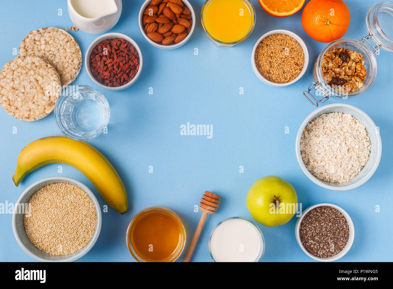 Useful breakfast on a blue pastel background, top view Stock Photo - Alamy