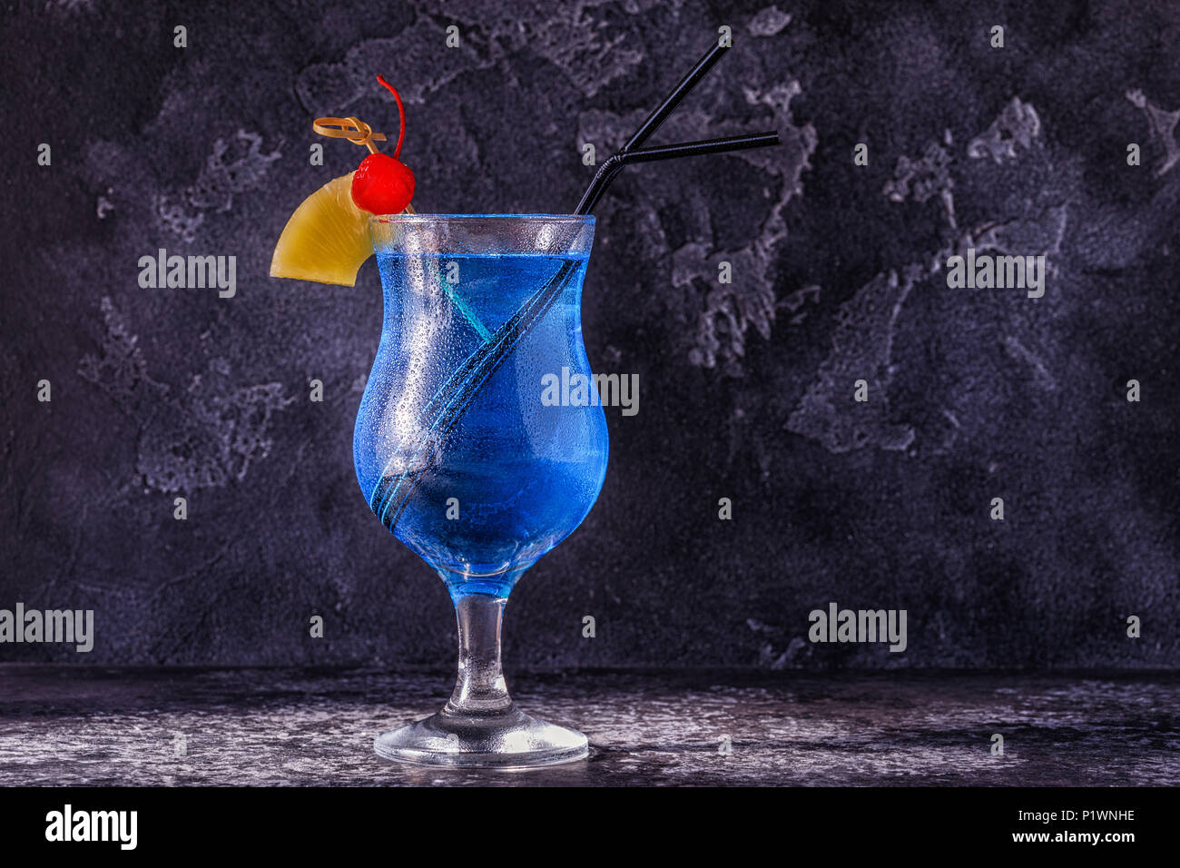 Blue Curacao cocktail decorated with fruit, selective focus Stock Photo ...