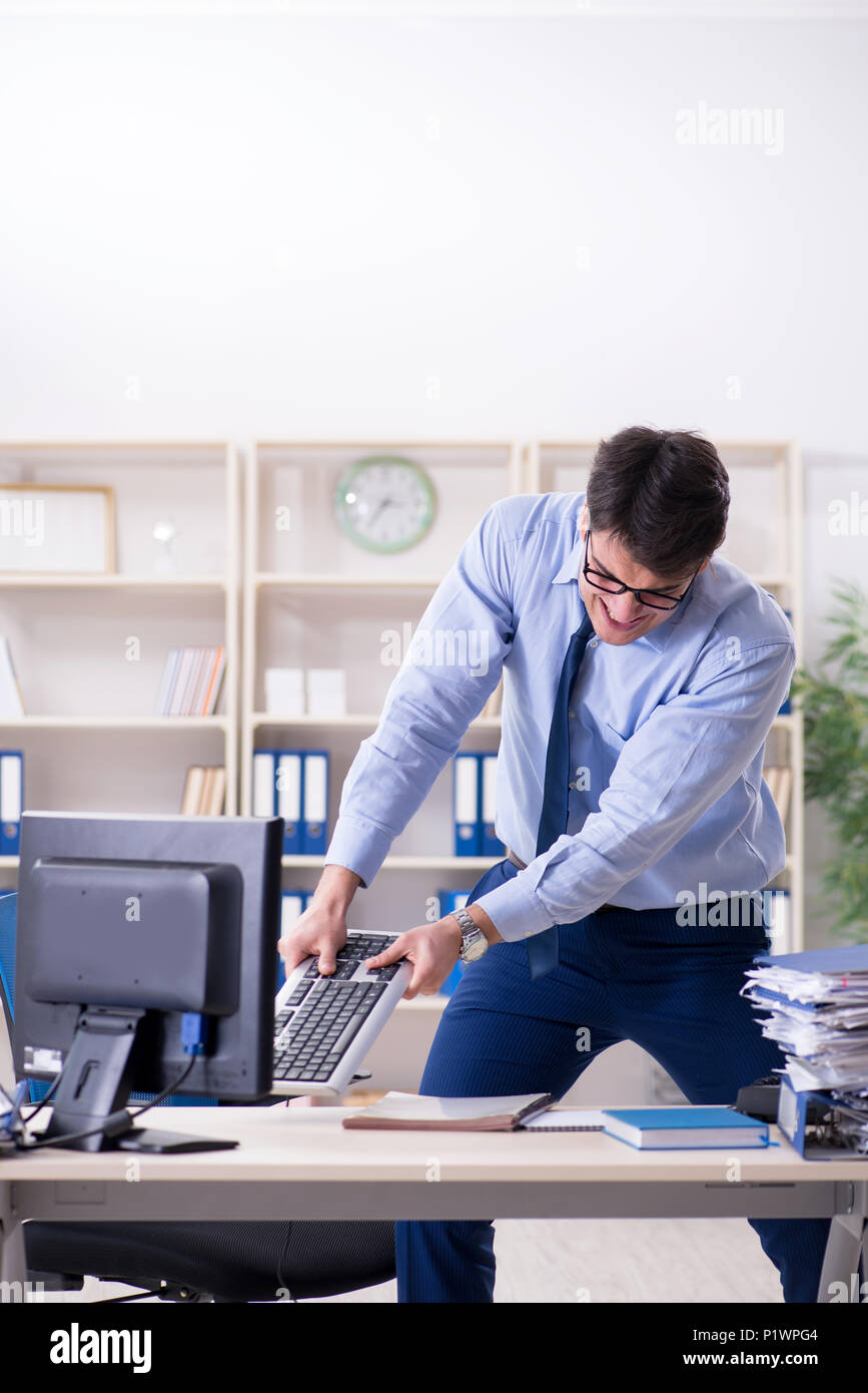 Angry businessman frustrated with too much work Stock Photo - Alamy